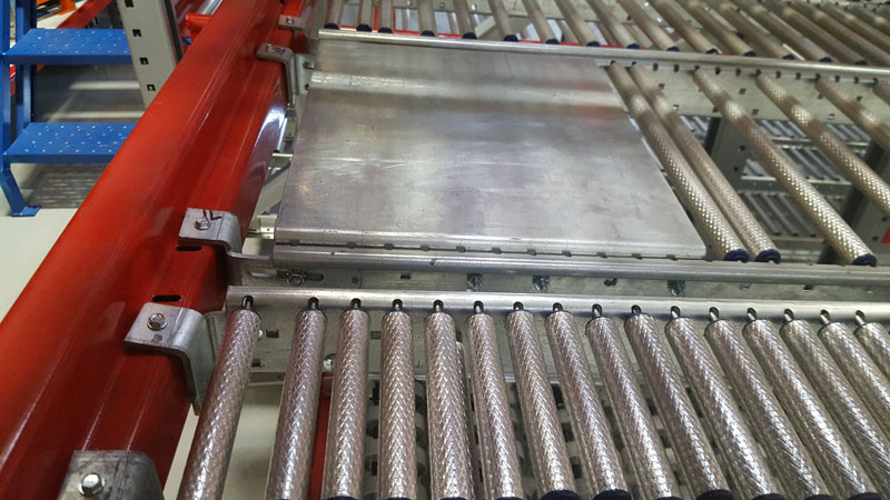 Photos of RhinoTrac Carton Flow Rack full-width conveyor style rollers