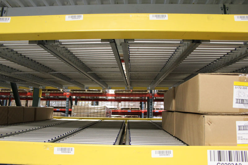 Photos of RhinoTrac Carton Flow Rack full-width conveyor style rollers