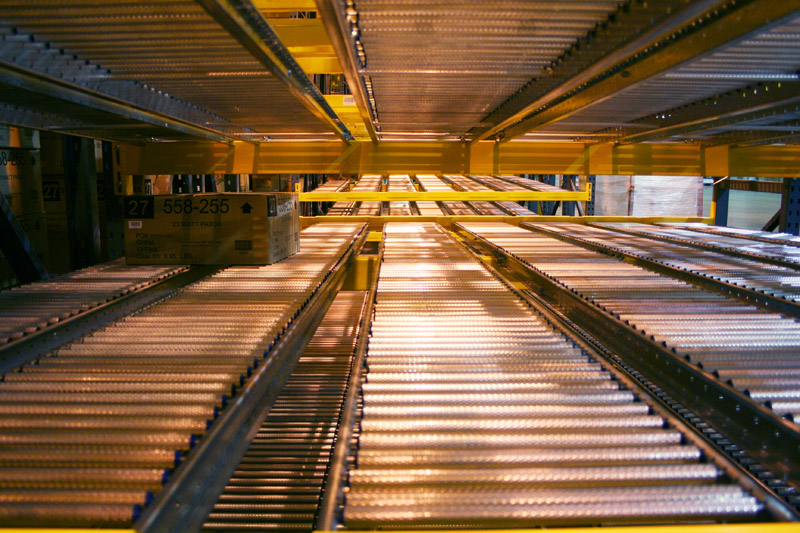 Photos of RhinoTrac Carton Flow Rack full-width conveyor style rollers