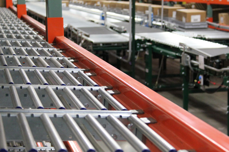 Photos of RhinoTrac Carton Flow Rack full-width conveyor style rollers
